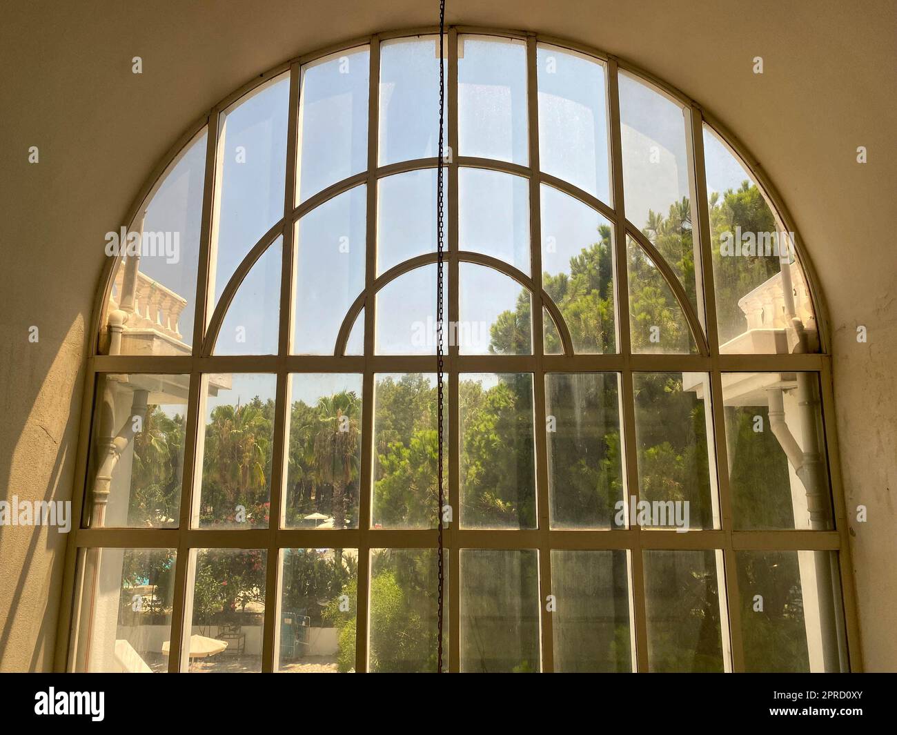 Bed from pallets in loft bedroom with white brick wall and big arch ...