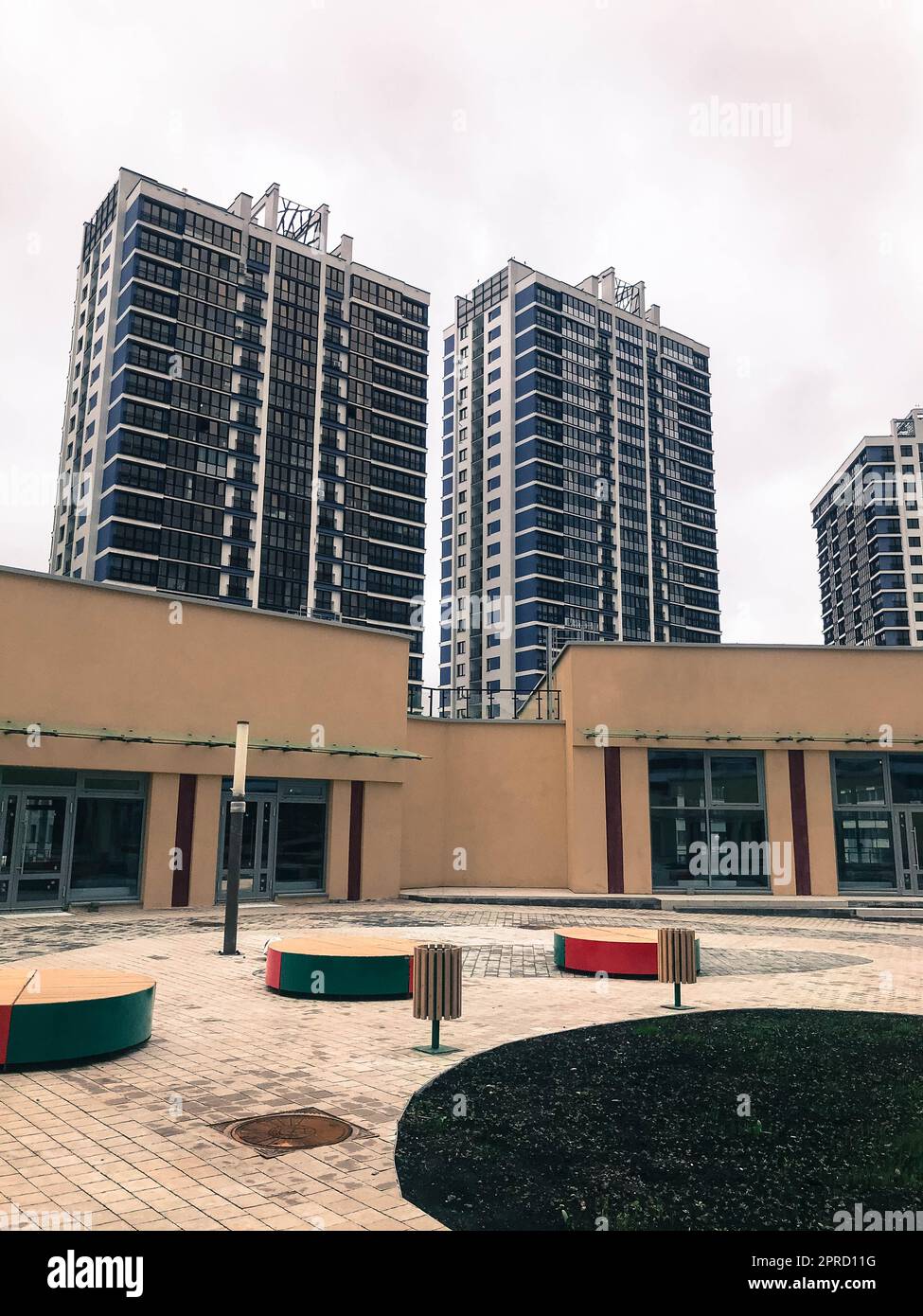 there is a round beige shopping center in the residential yard. bright ...