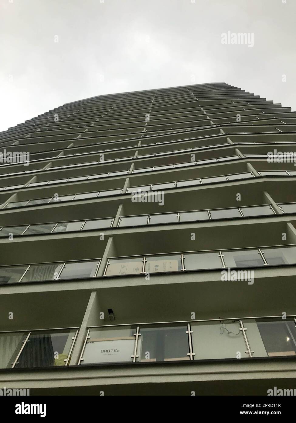 a beautiful tall white residential building with unusual architecture ...