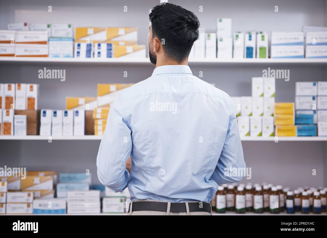 Pharmacy, medicine and back of man check shelf for medication ...