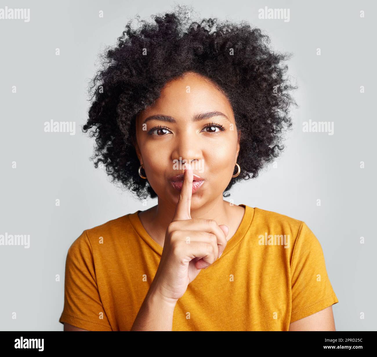 Portrait, woman and secret with finger on lips for privacy, mystery and ...