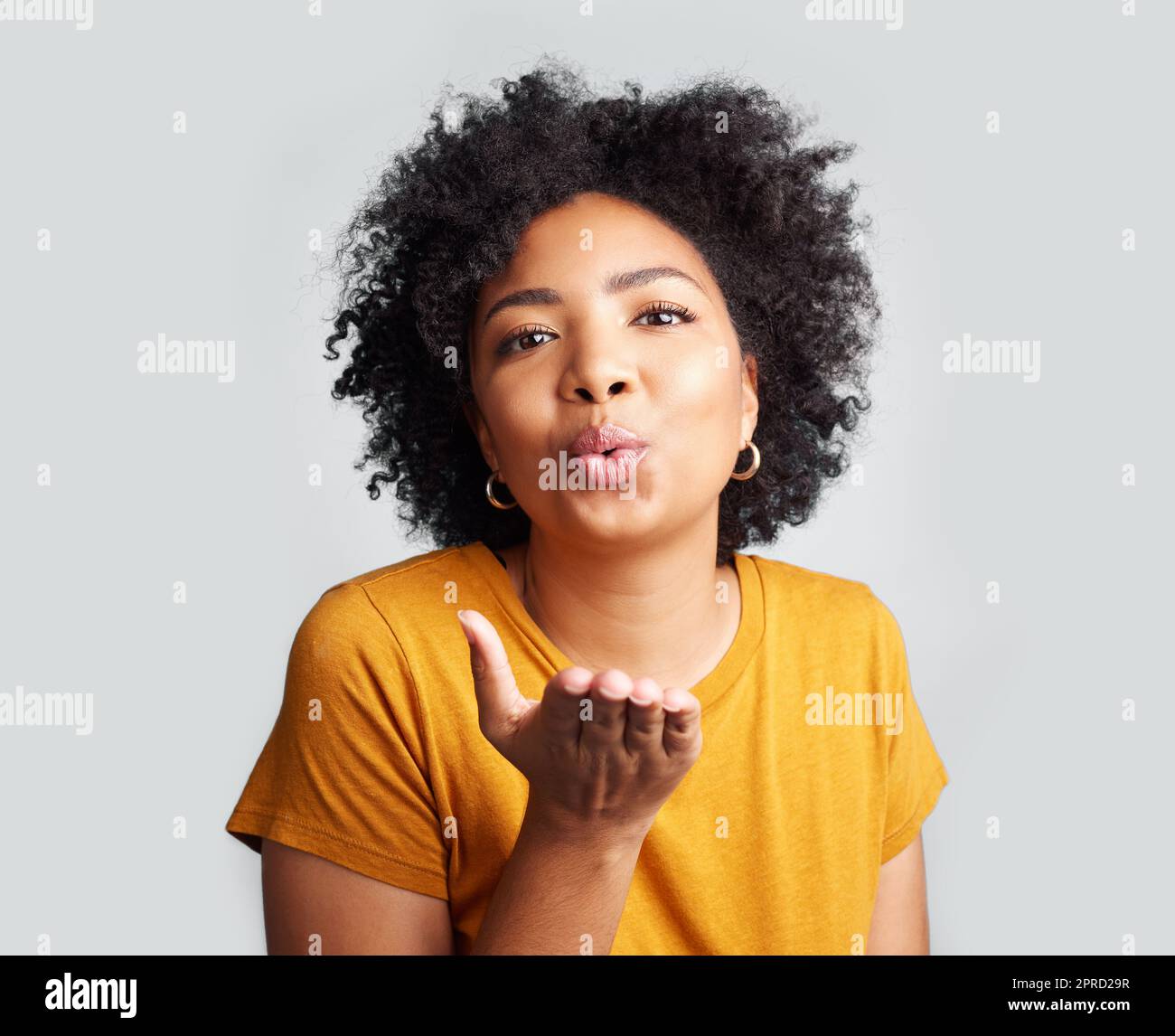 Portrait, woman and blowing kiss in white background, studio and ...