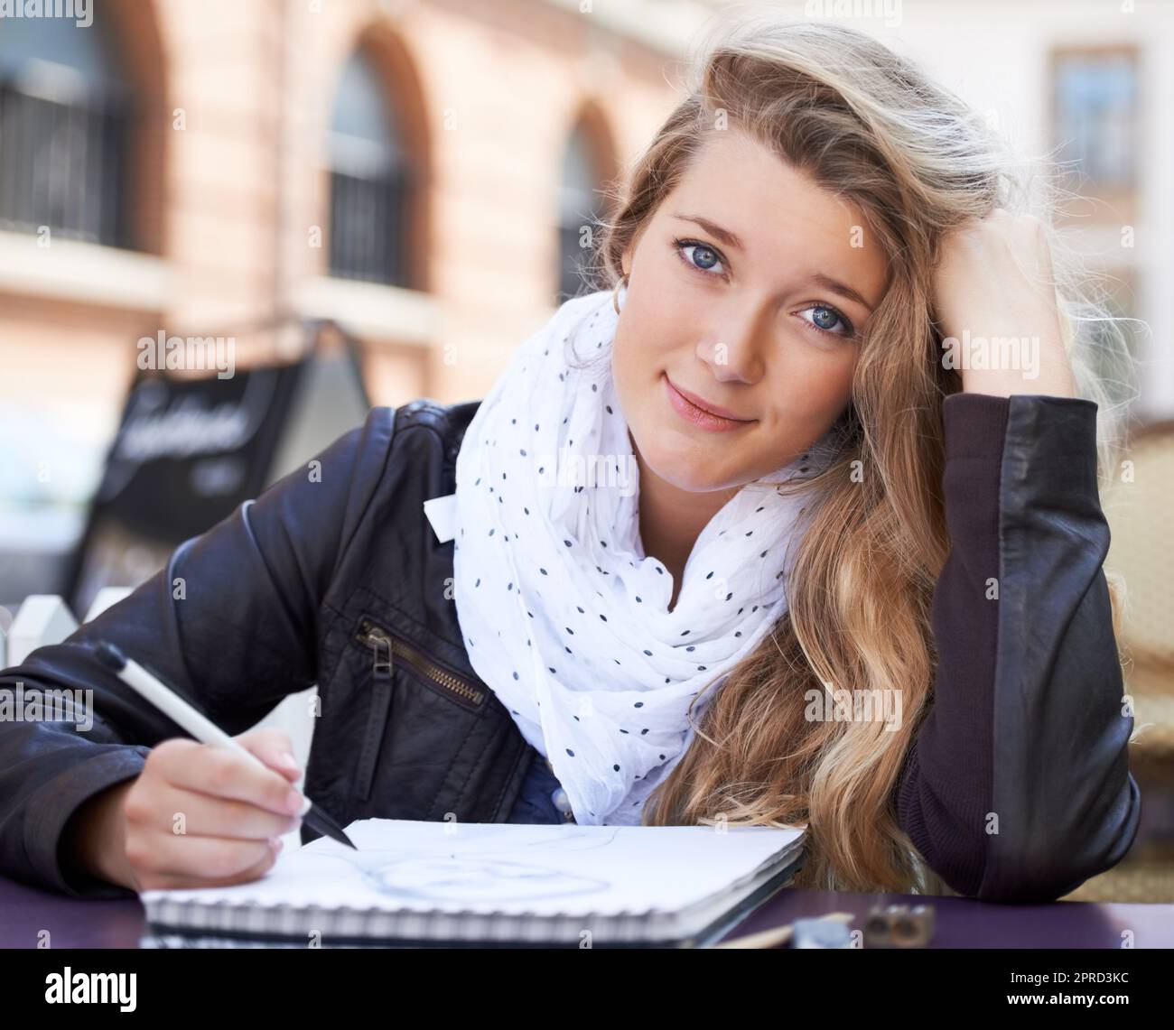 Creative, portrait and student drawing in the city on a notepad for an ...