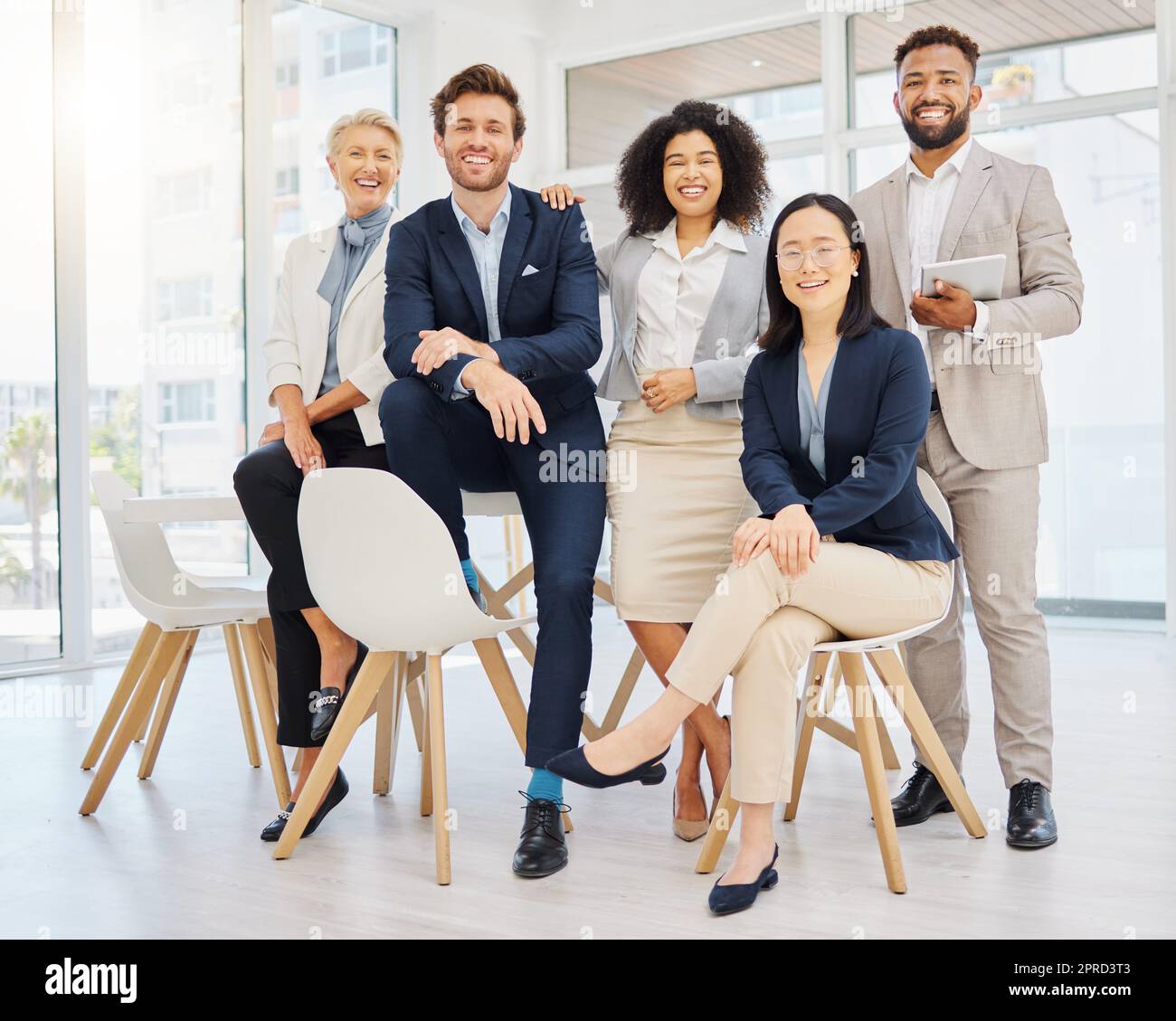 Success, happy and portrait of business people on chair in office with ...