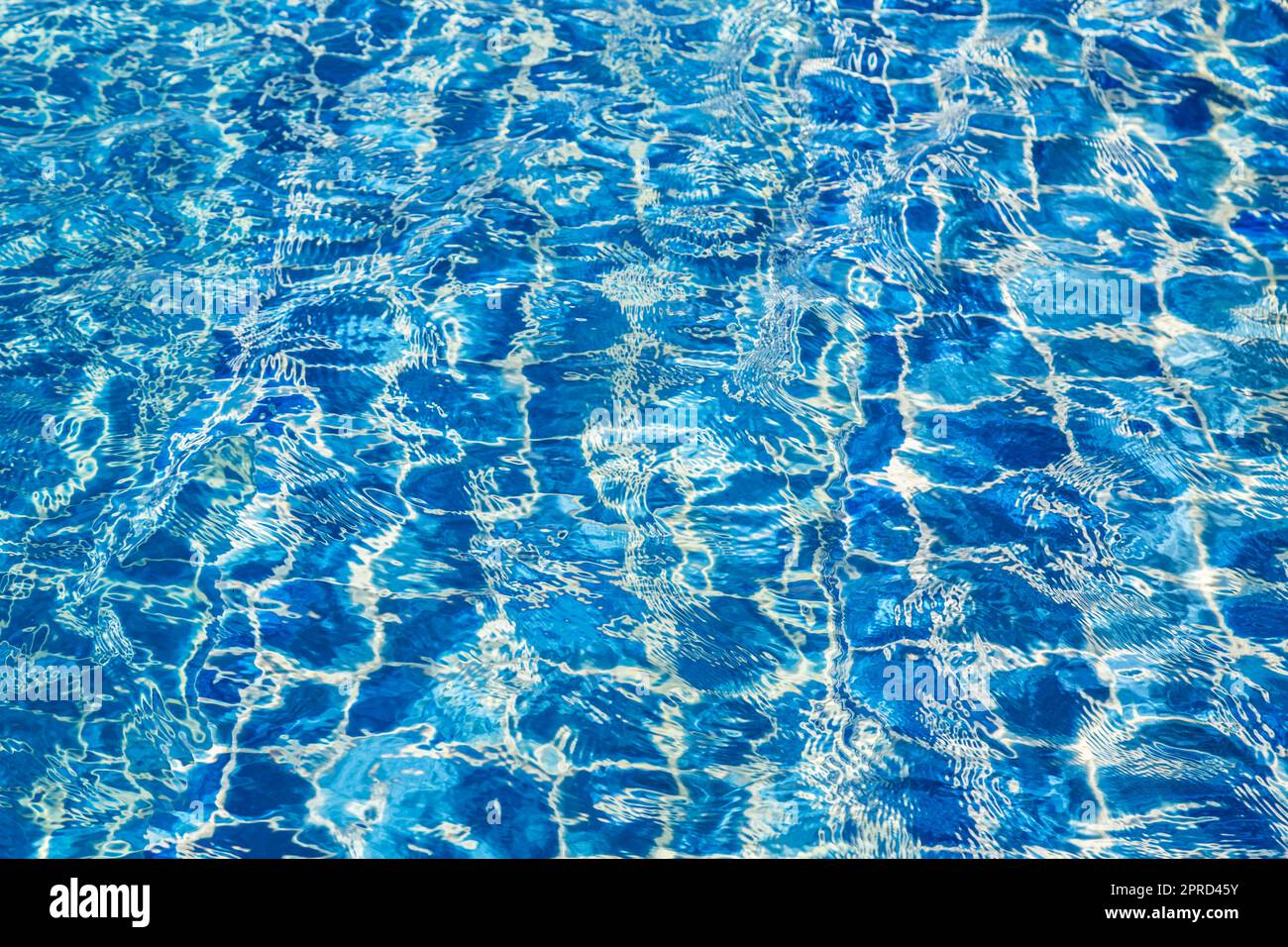 Blue color water in swimming pool rippled background Stock Photo - Alamy