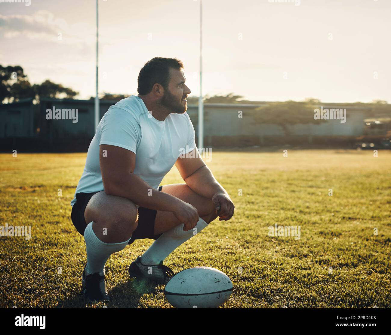 The field is home. Full length shot of a handsome young rugby player ...