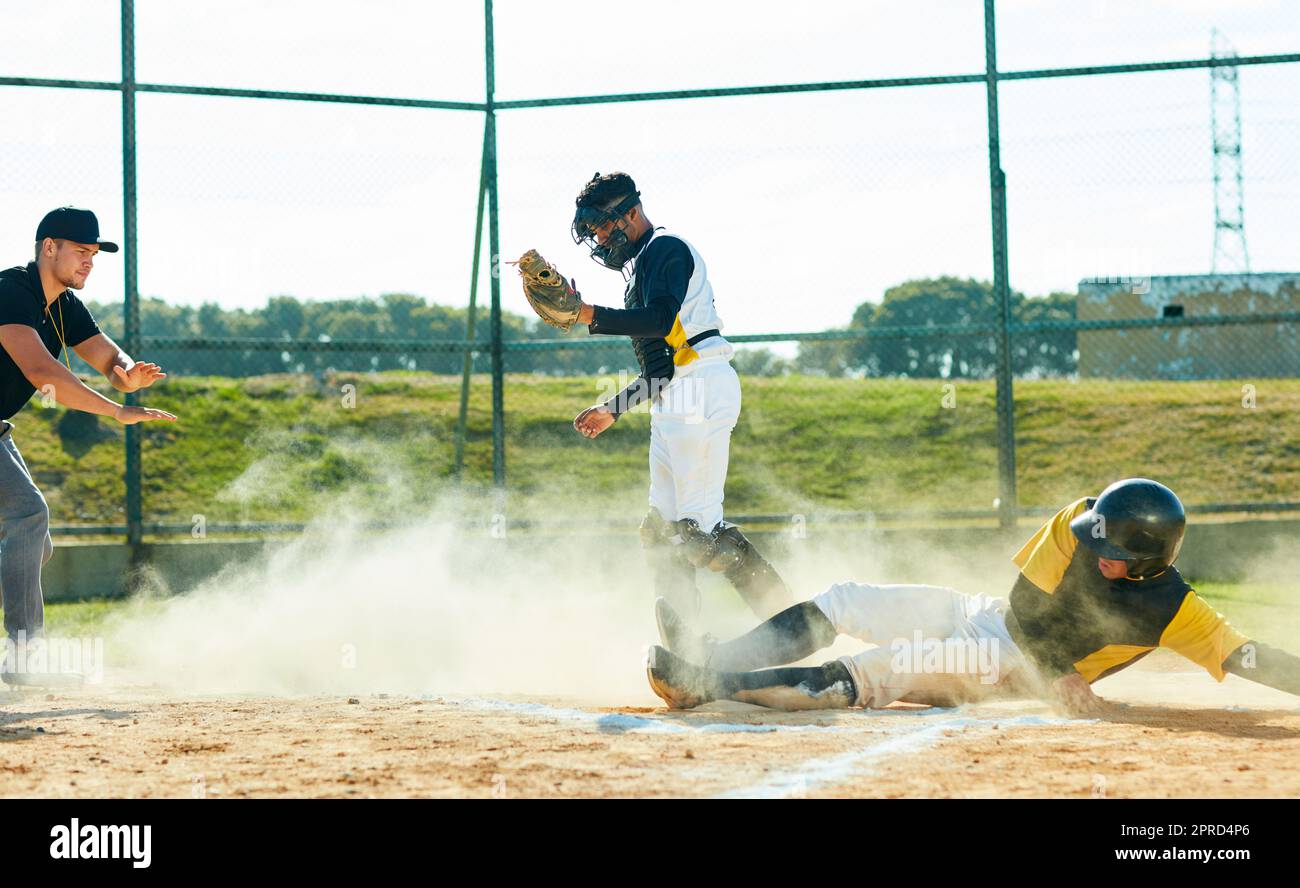 The dust is his playground. Full length shot of a young baseball player ...