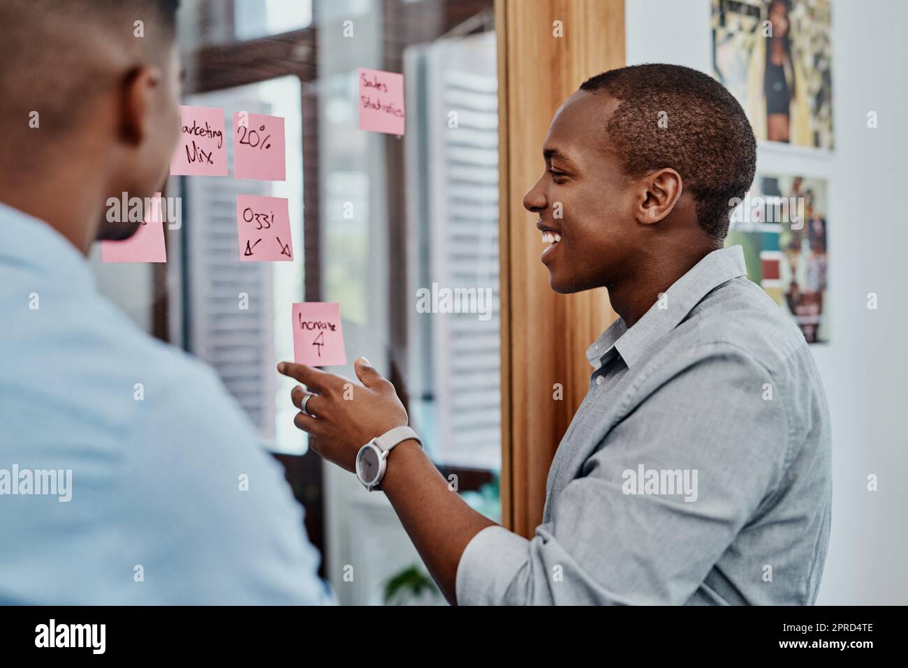 A grand get it done plan. two young young businessmen having a ...