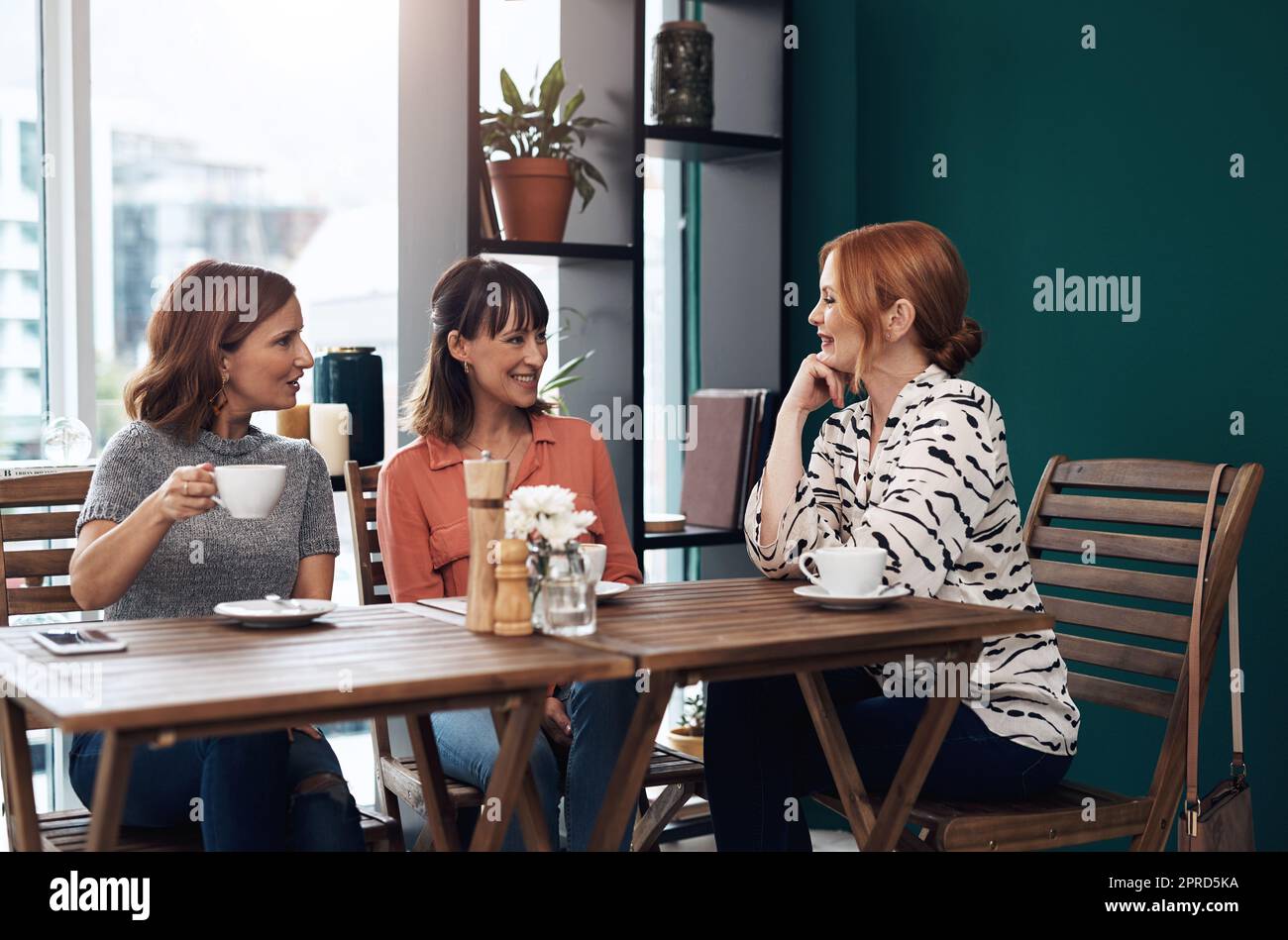 Mature friends laughing inside social hi-res stock photography and ...