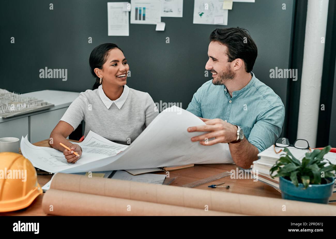 Leave the creative minds to work at it. two architects working with ...