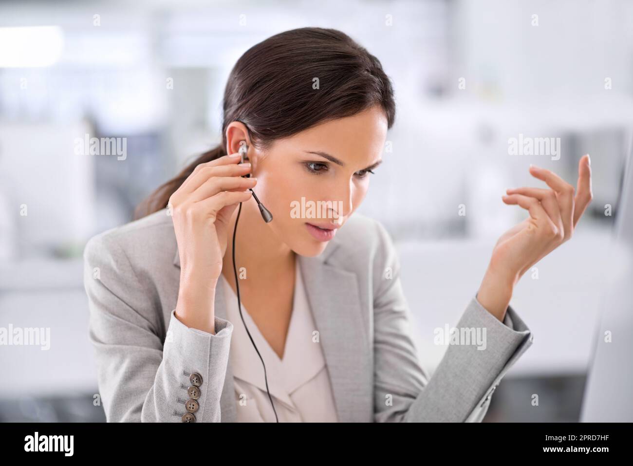 Call center agent helping a client via phone call to give them good ...