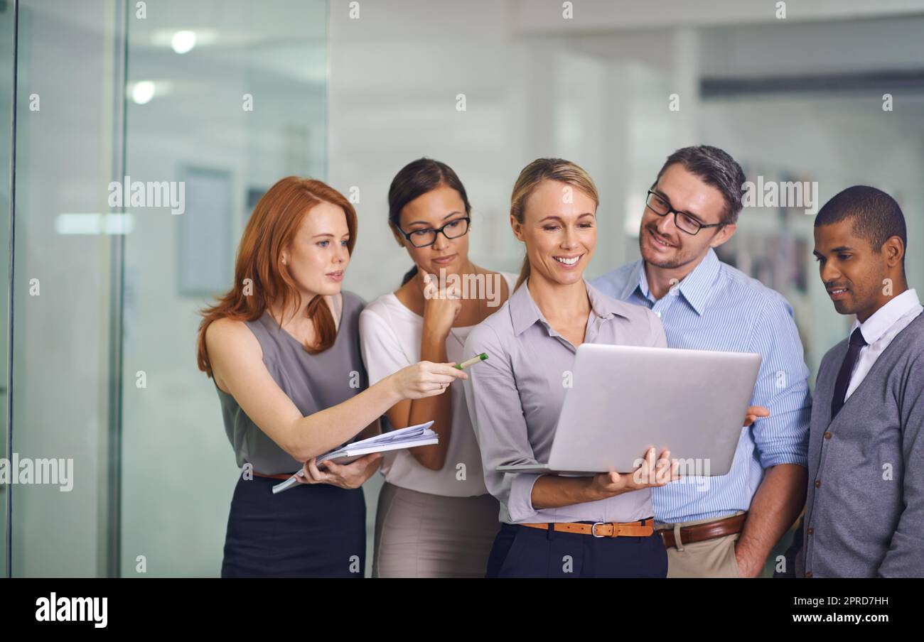 Manager with laptop showing, training or presenting strategy ideas or ...