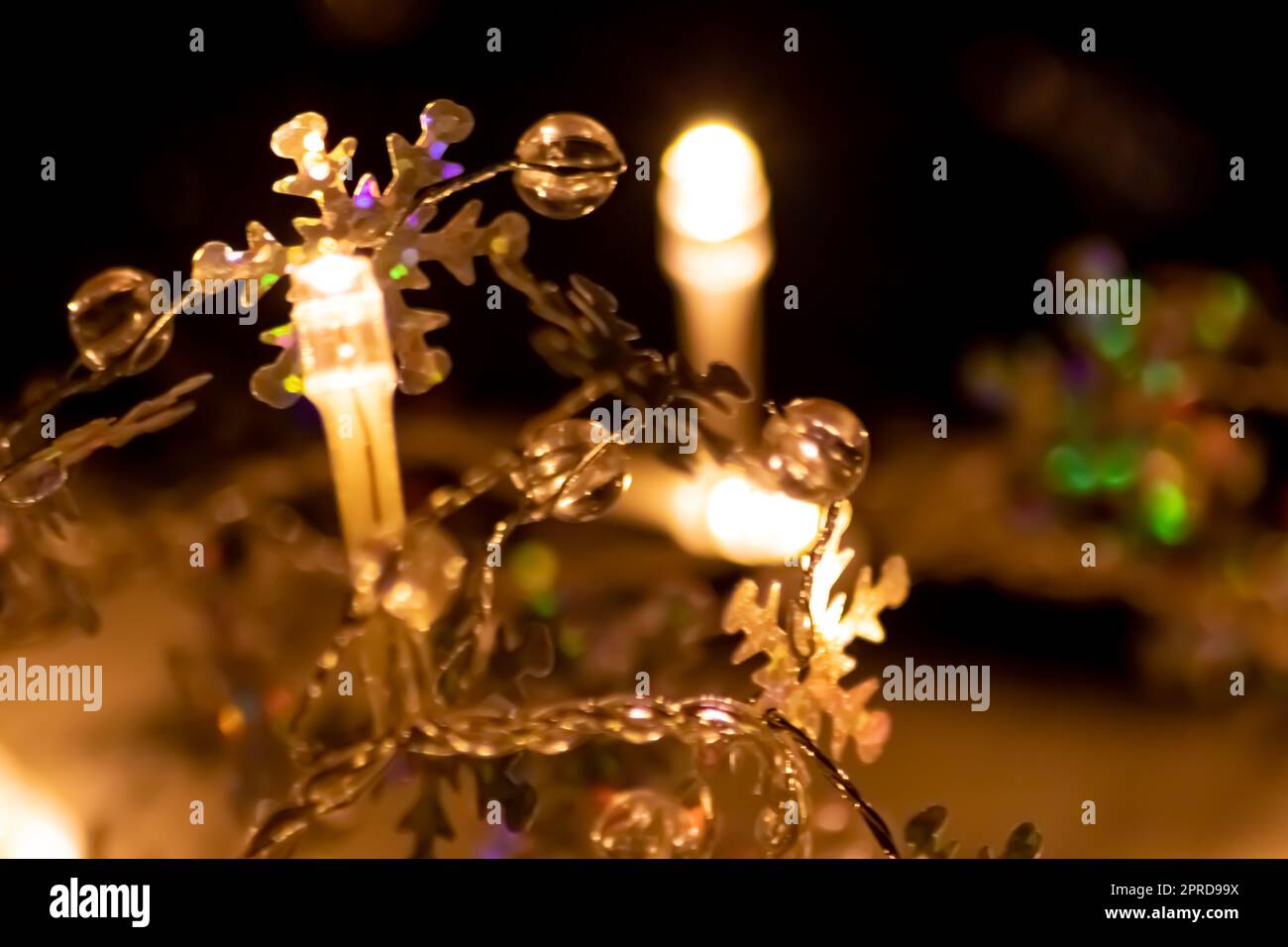 Colorful Christmas lights as multi colored chain of lights for a happy ...