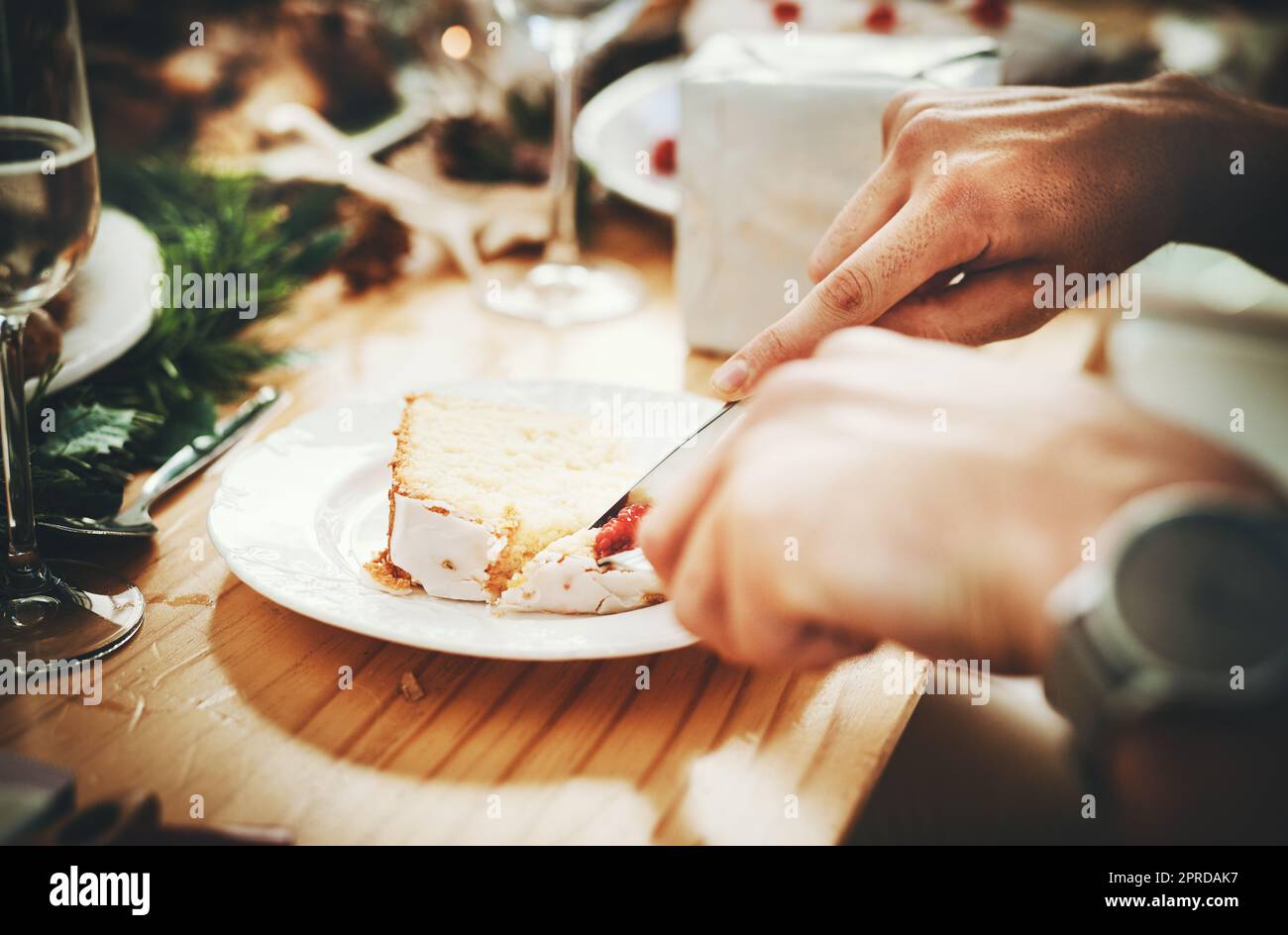 Its time for something sweet. an unrecognizable man having cake while ...