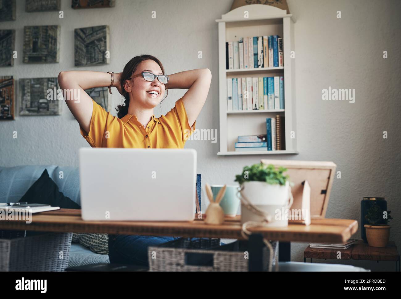 Thats another task ticked off the to-do list. an attractive young businesswoman sitting alone in ...