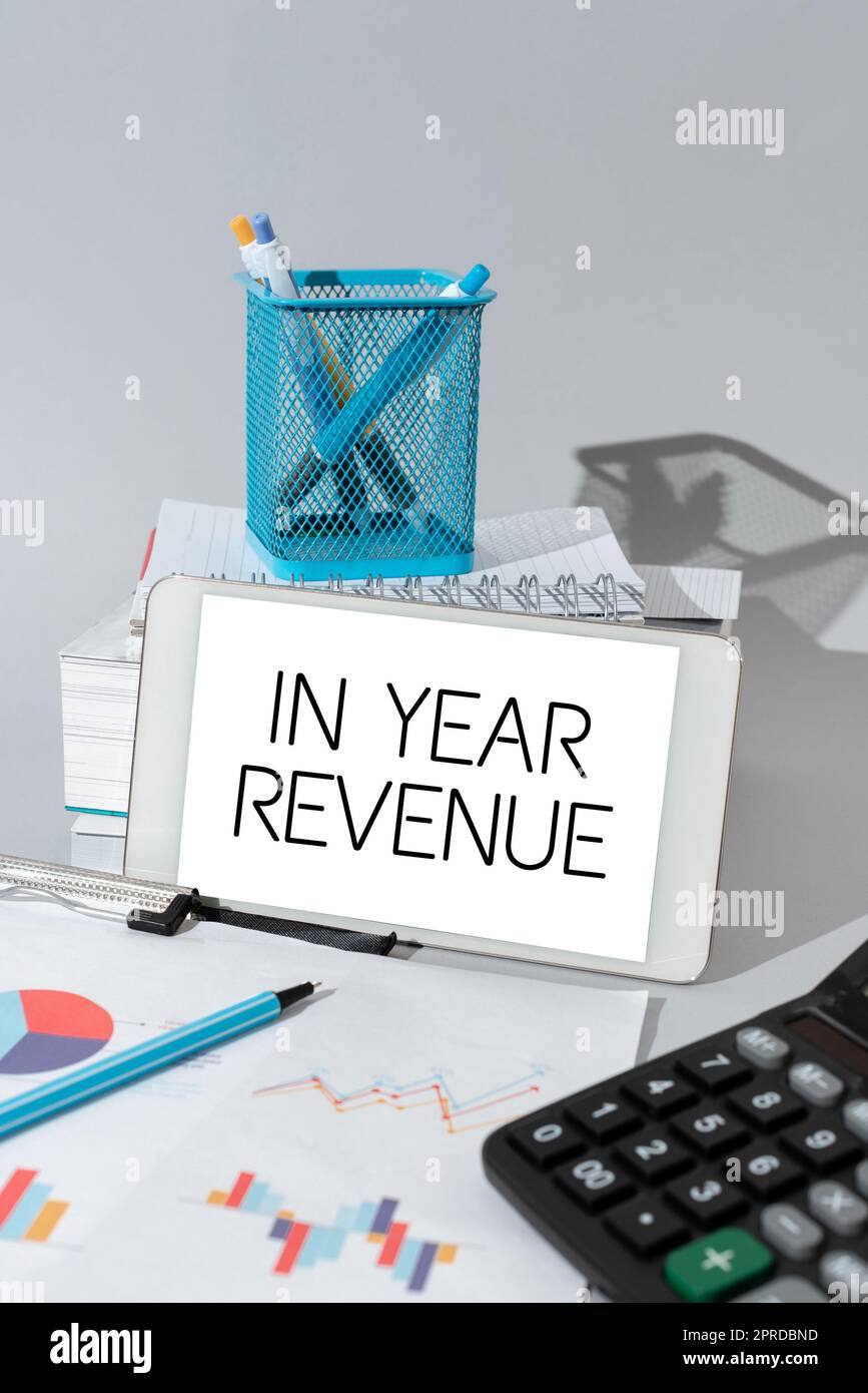Handwriting text In Year Revenue. Word Written on Annual business ...