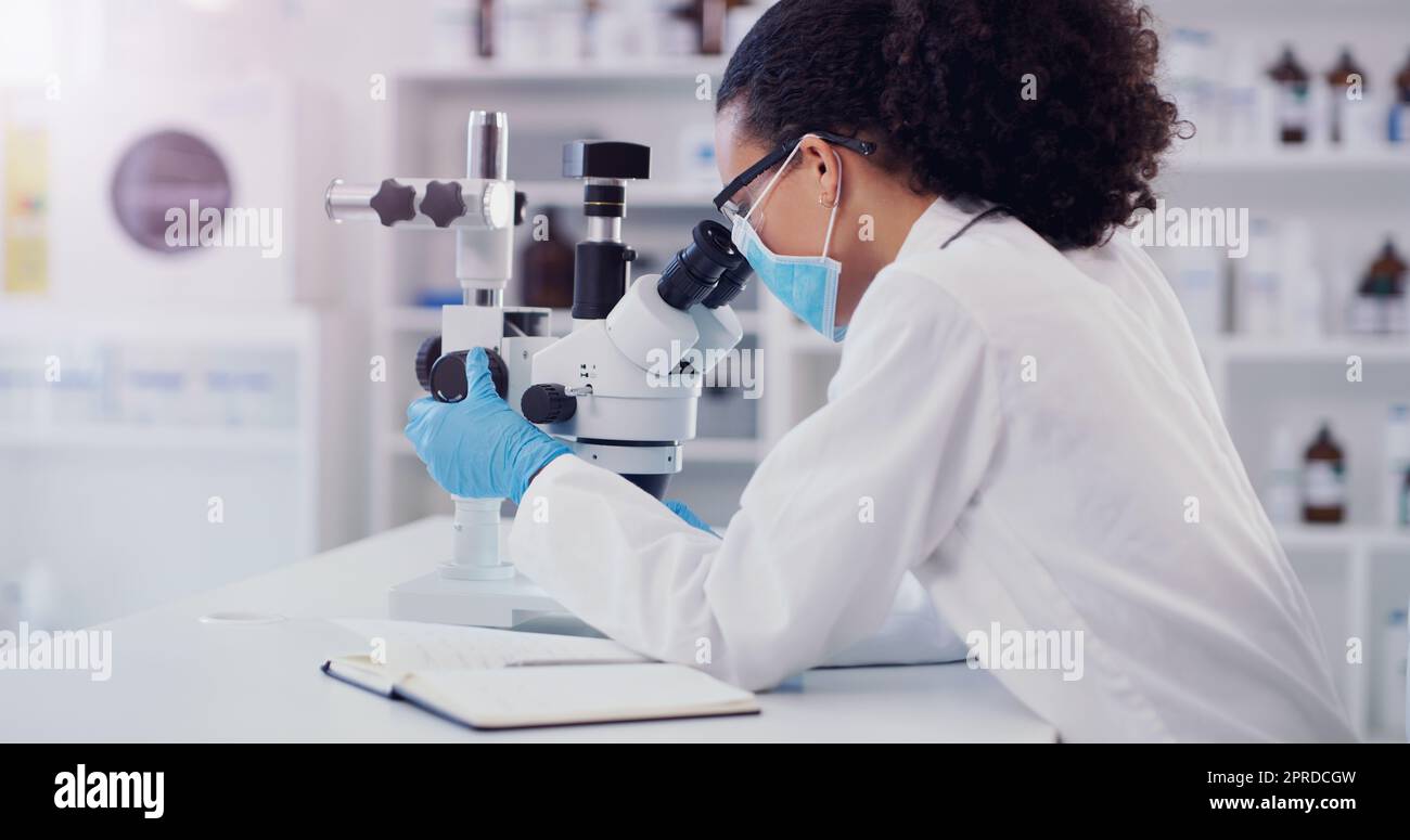 Scientist looking under the microscope hi-res stock photography and ...