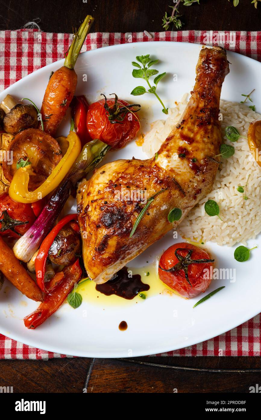 Rustic fried chicken legs with assorted vegetables and rice Stock Photo ...