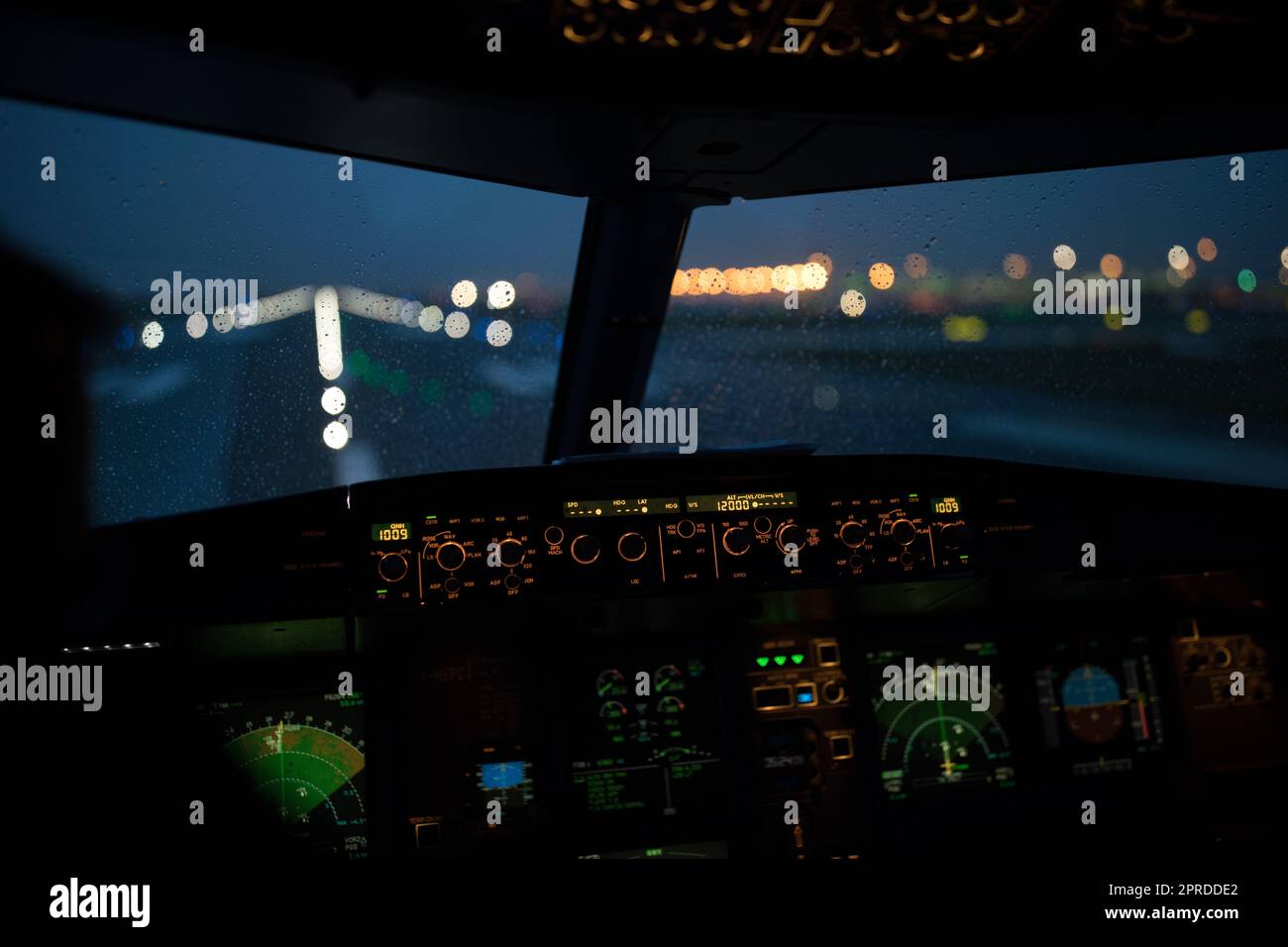Pilot's hand accelerating on the throttle in a commercial airliner ...
