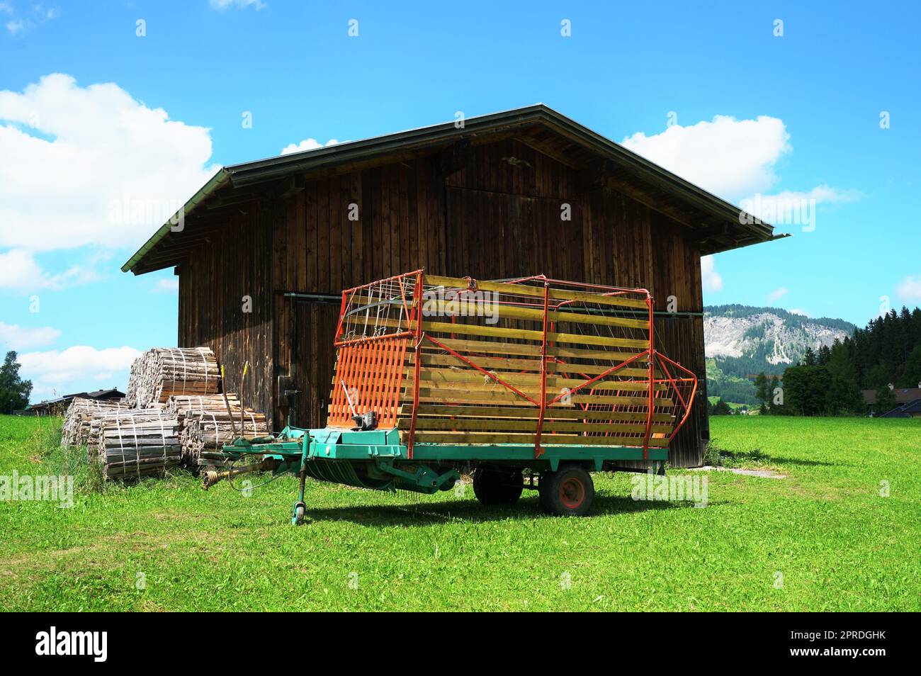 Wooden shed on a meadow under a blue sky Stock Photo - Alamy
