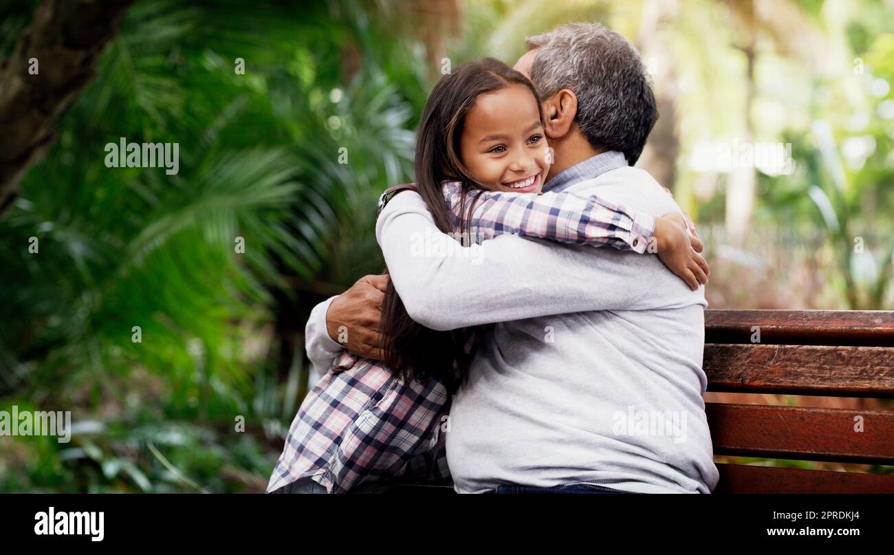 Children hugging grandfather hi-res stock photography and images - Alamy