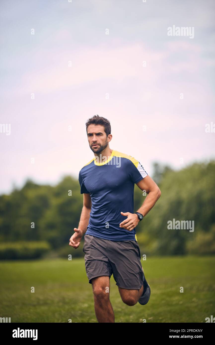 I feel feel how exercise is good for me. a sporty middle-aged man out ...