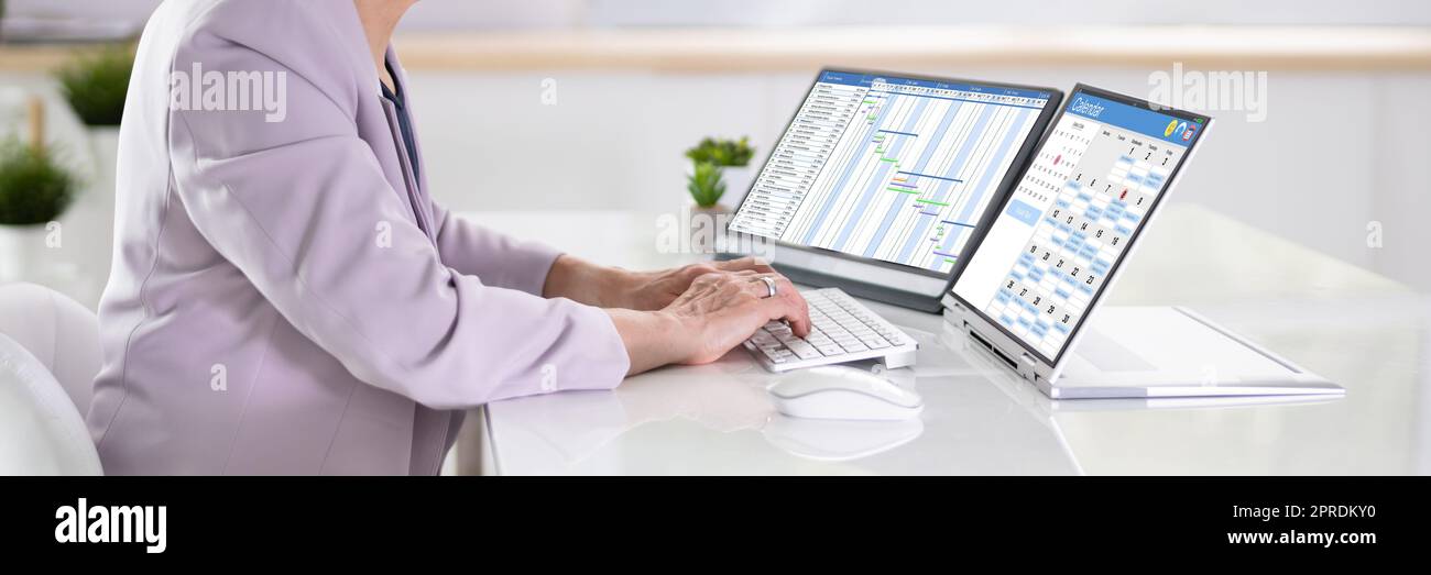 Employee Working On Calendar Schedule Stock Photo - Alamy