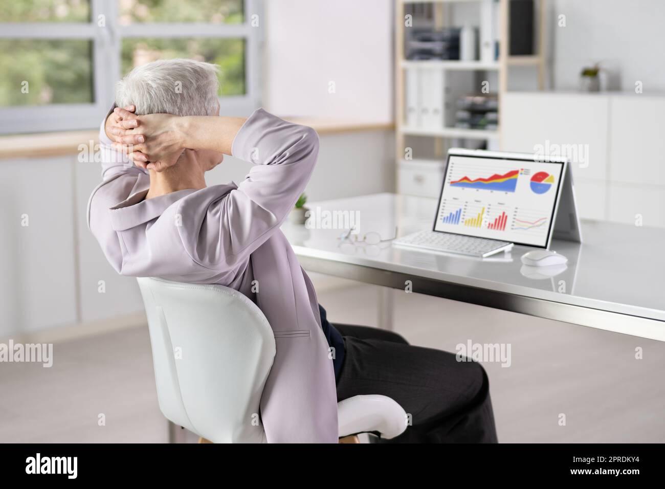 Advisor Woman Relaxing In Office Chair Stock Photo - Alamy
