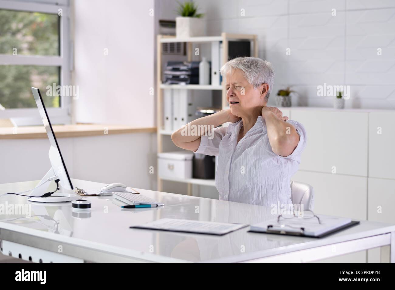 Neck Pain Bad Posture Stress At Computer Stock Photo - Alamy
