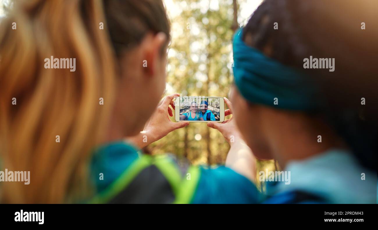 Selfie for the progress. two sporty young woman taking pictures while ...