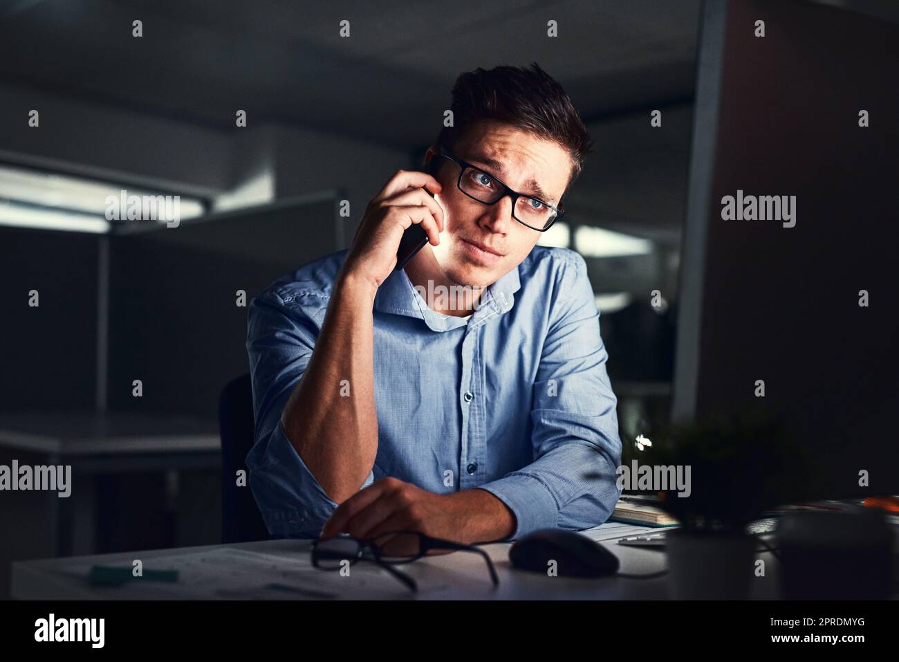Serious man talking on phone hi-res stock photography and images - Alamy