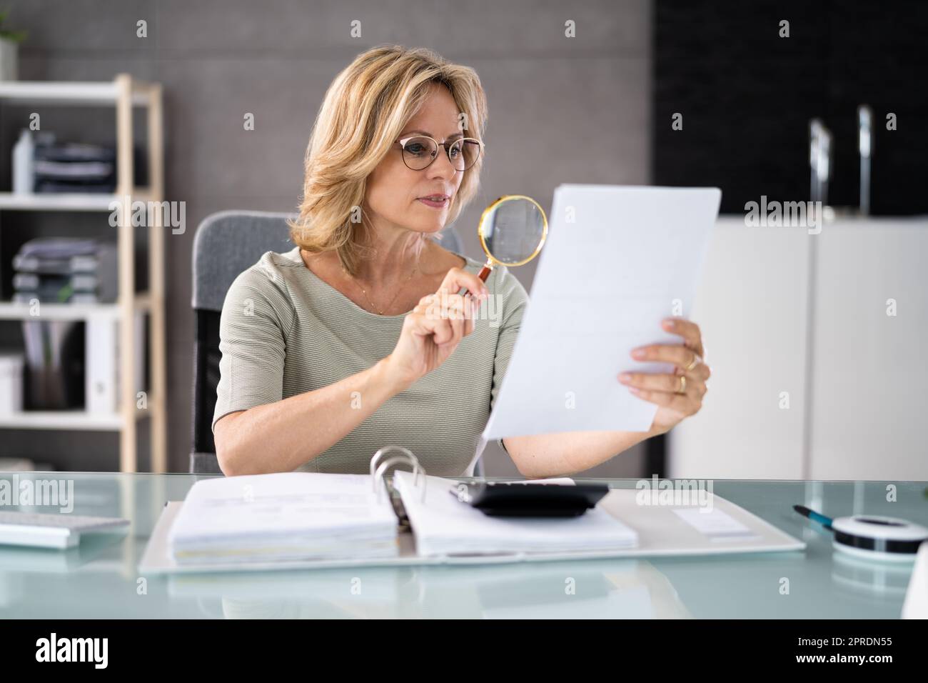 Investigate Fraud And Examine Document Stock Photo - Alamy