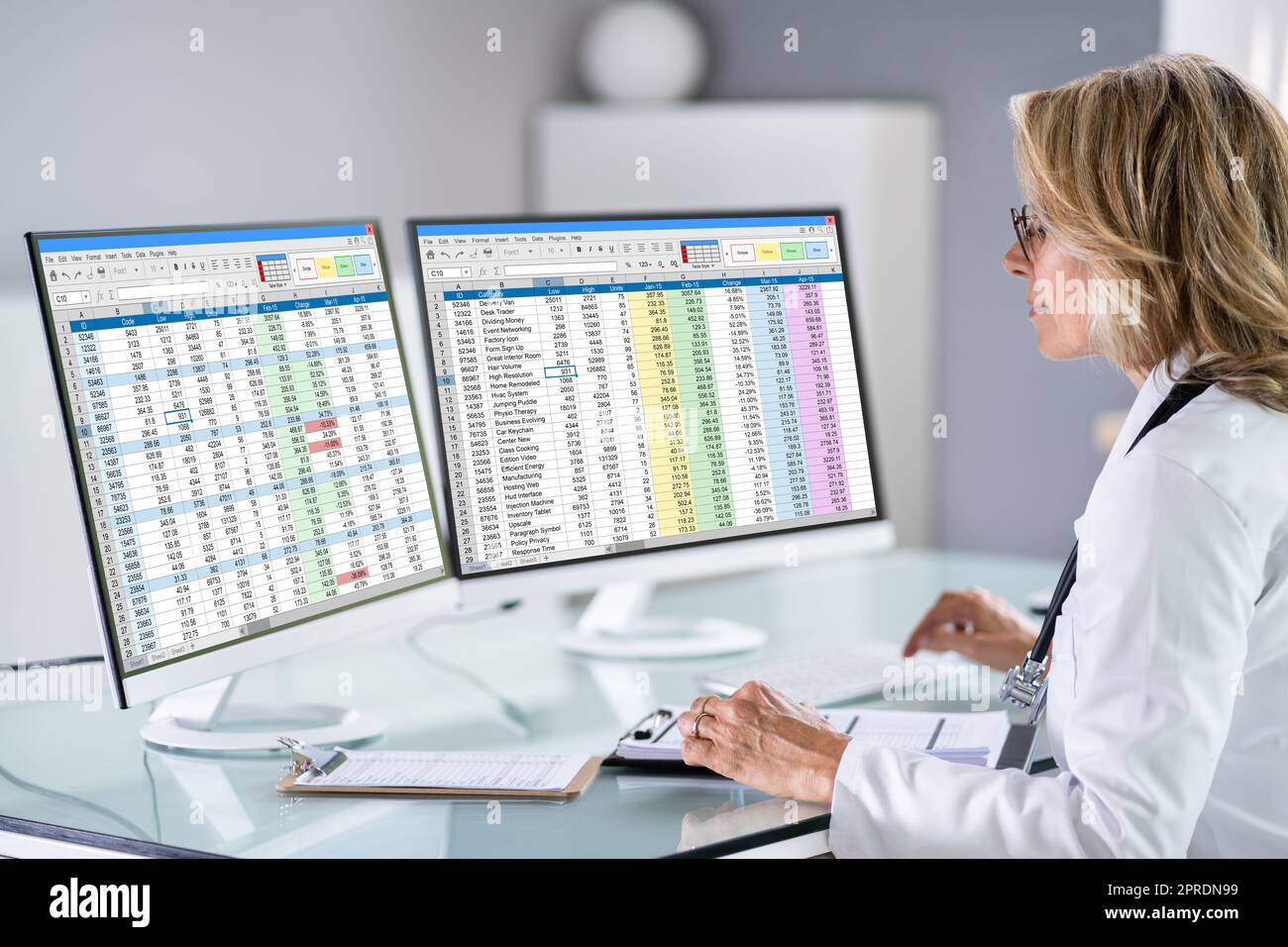 Hospital Doctor Using Spreadsheet For Billing Codes Stock Photo - Alamy