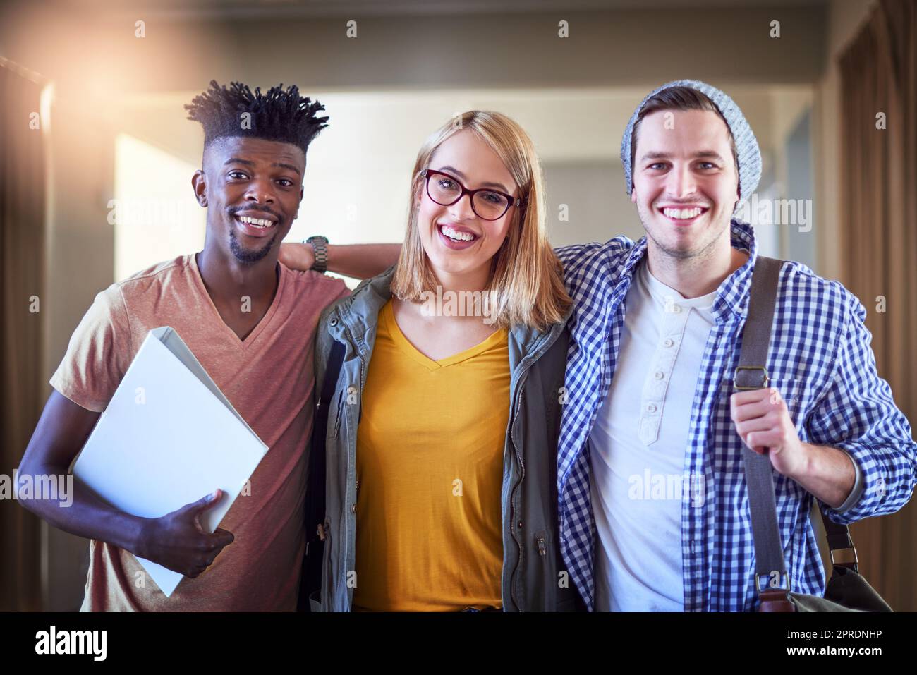 Three students standing school corridor hi-res stock photography and ...