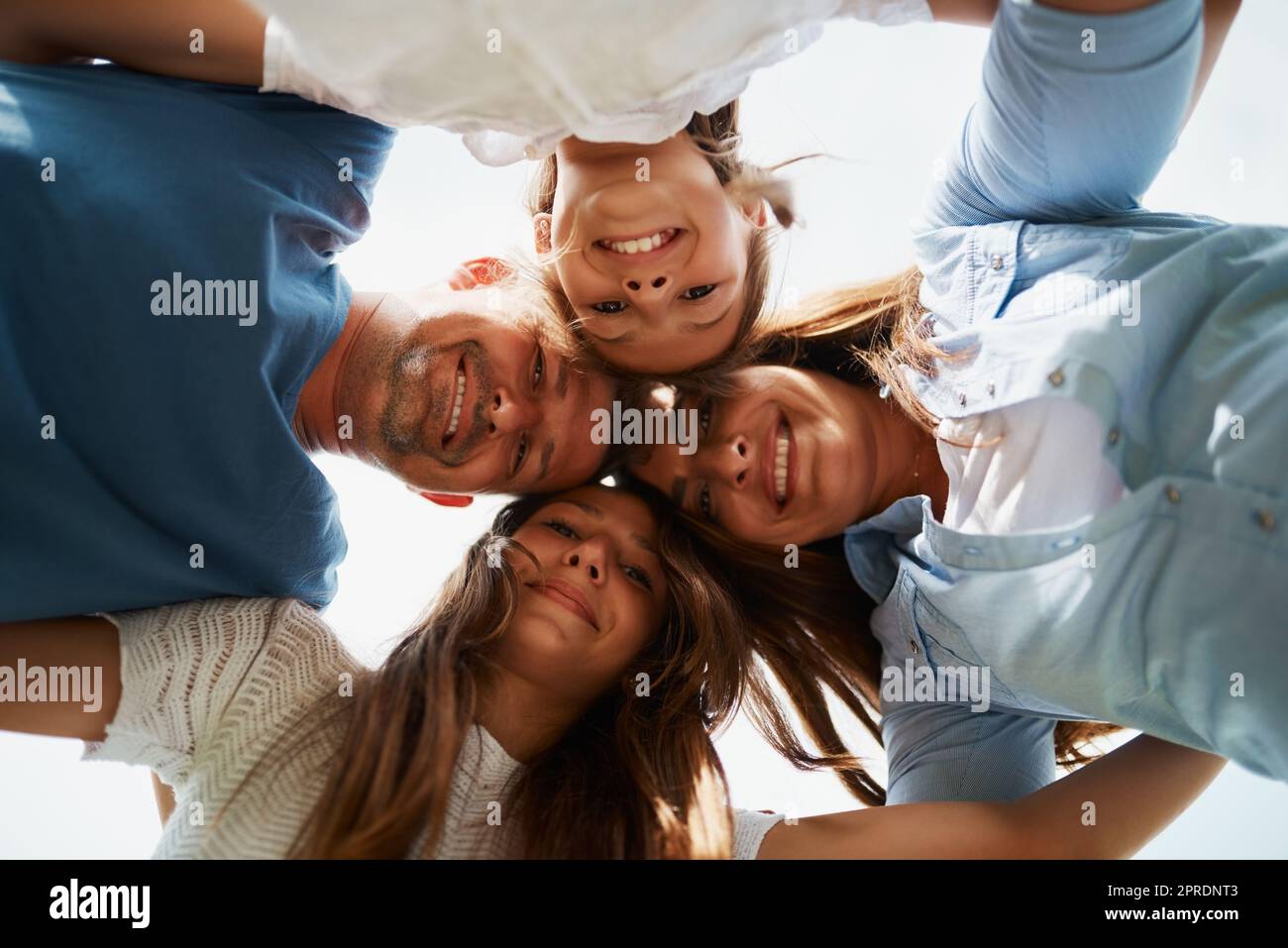 Were in this together. Low angle portrait of a young family of four ...