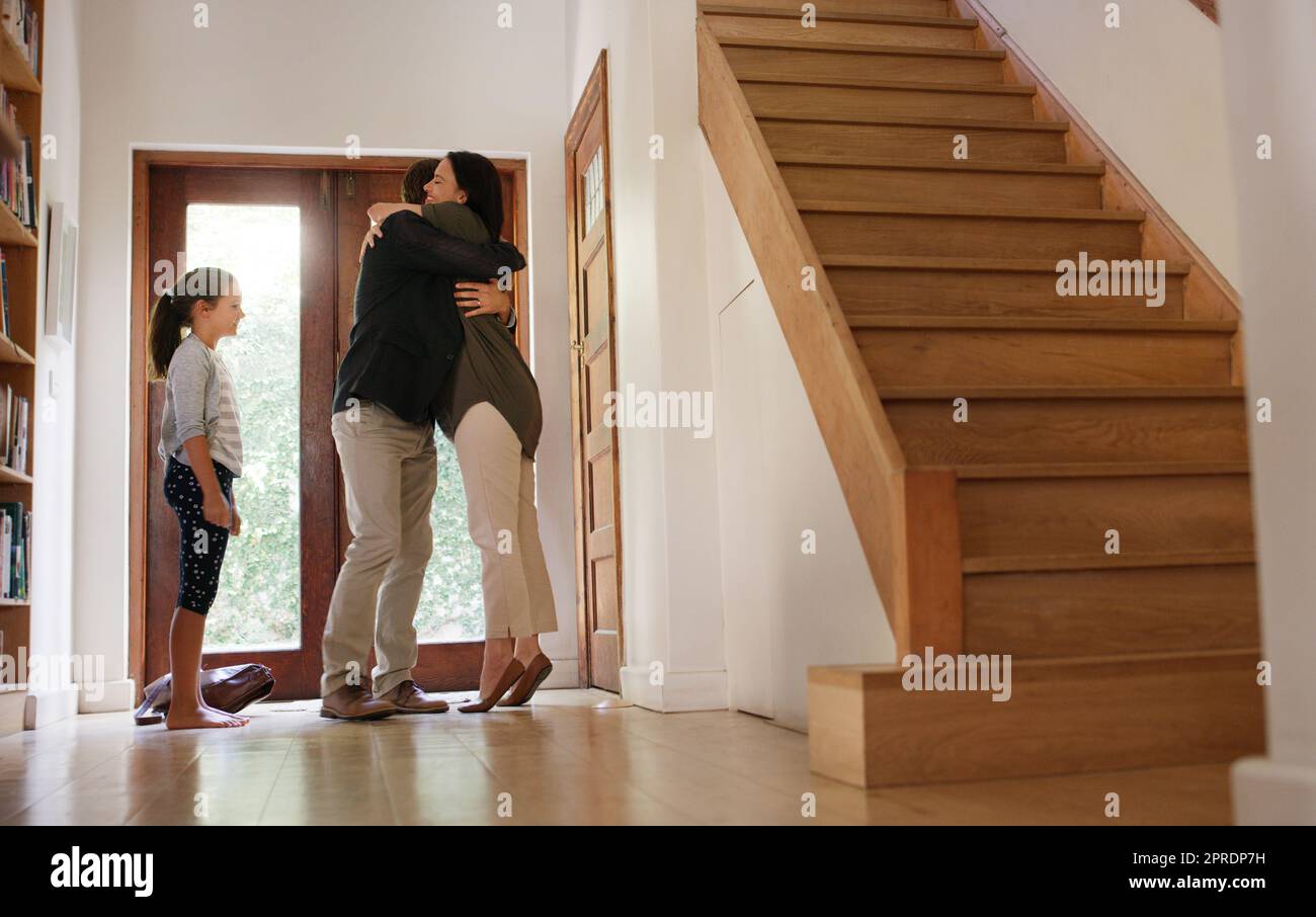 Welcome back honey. Full length shot of an affectionate young mother ...