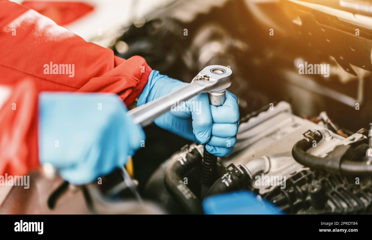 Auto mechanic working in garage. Repair service Stock Photo - Alamy