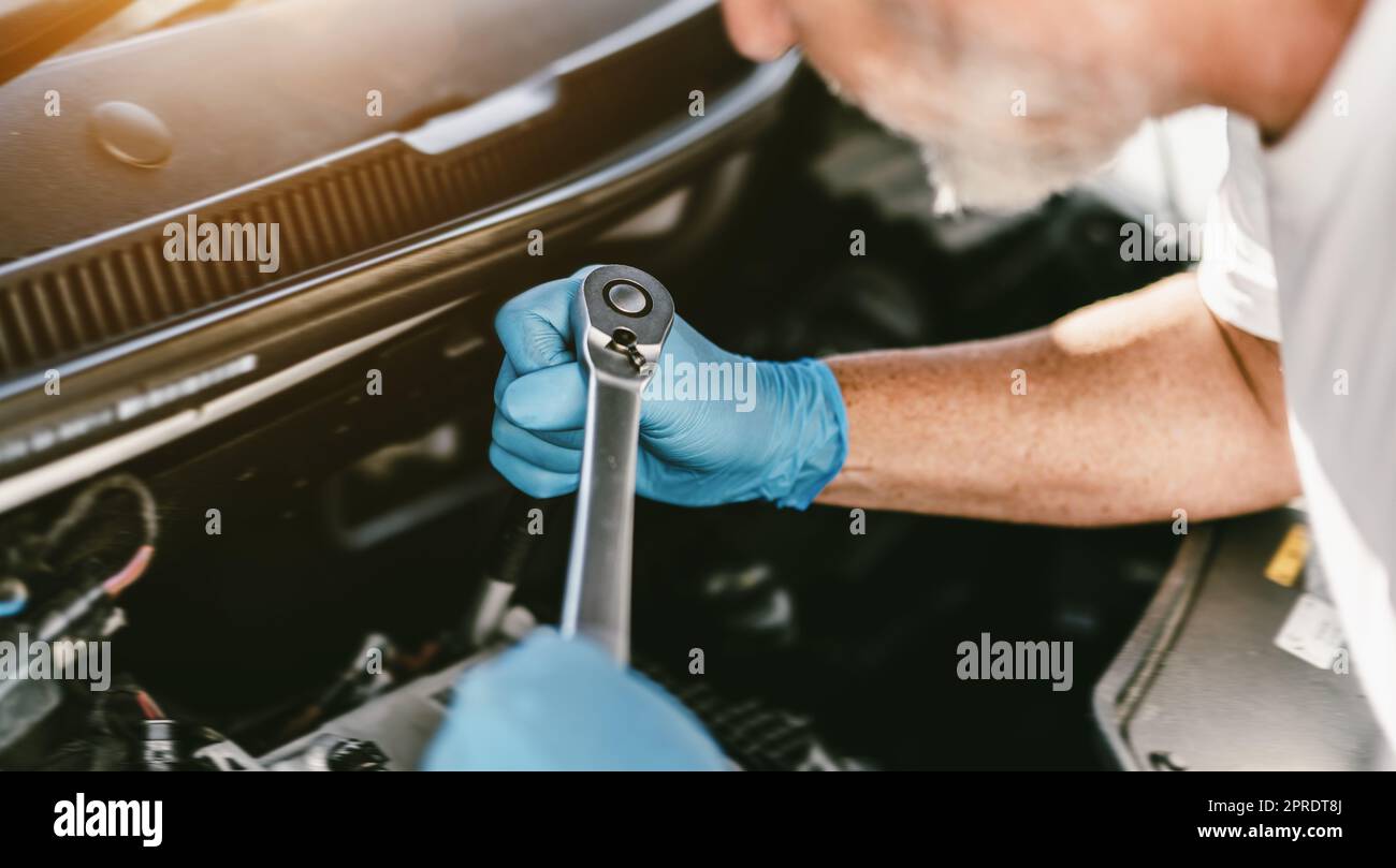 Auto mechanic working in garage. Repair service Stock Photo - Alamy