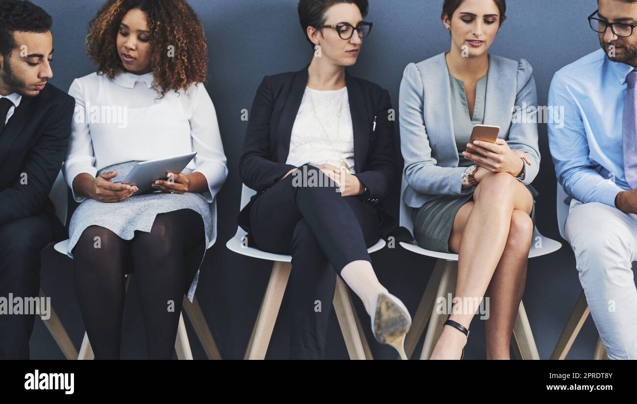 Business people waiting in line and sharing information with technology ...