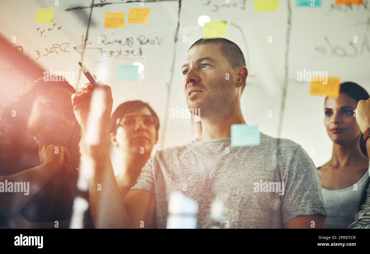 Business teamwork, planning in meeting writing sticky notes to ...