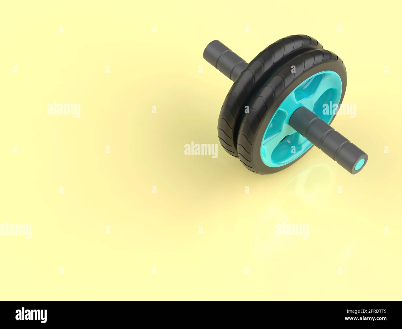 Abdominal toning wheel on shiny yellow floor Stock Photo - Alamy