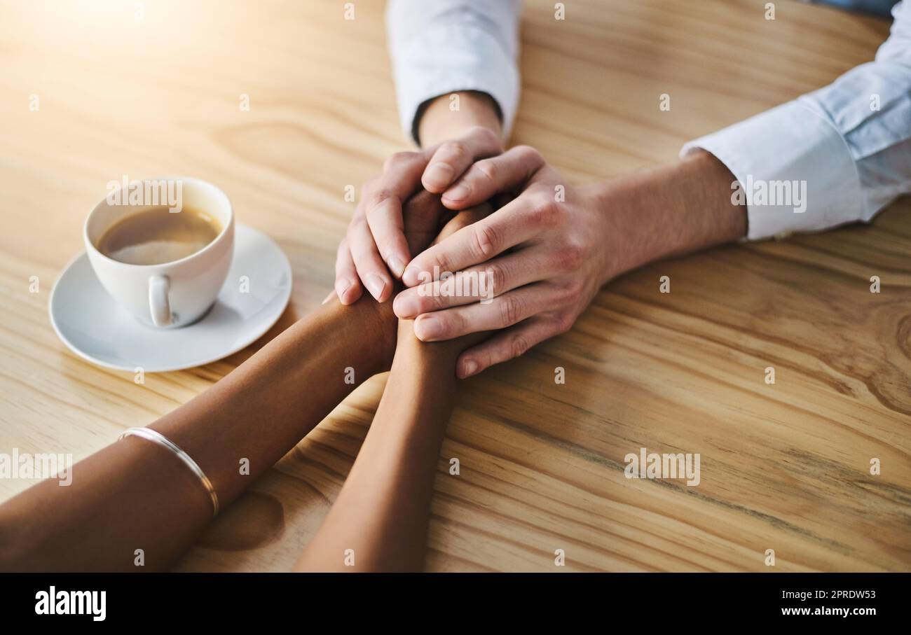 Your helping hand can change lives. Closeup shot of two people holding ...