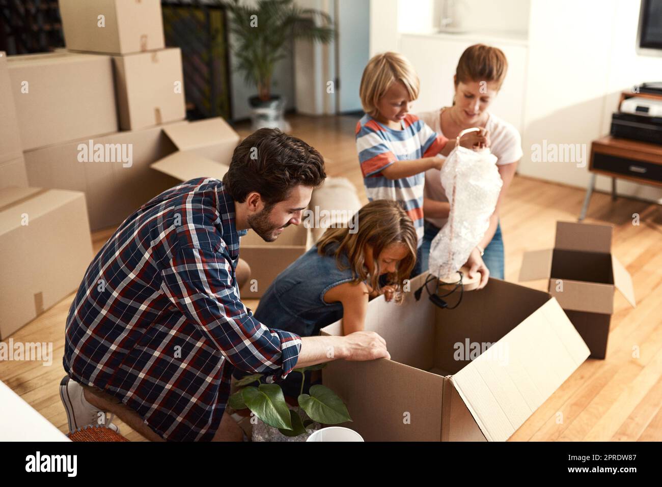 New house, new place to make a home. a young family on their moving day ...