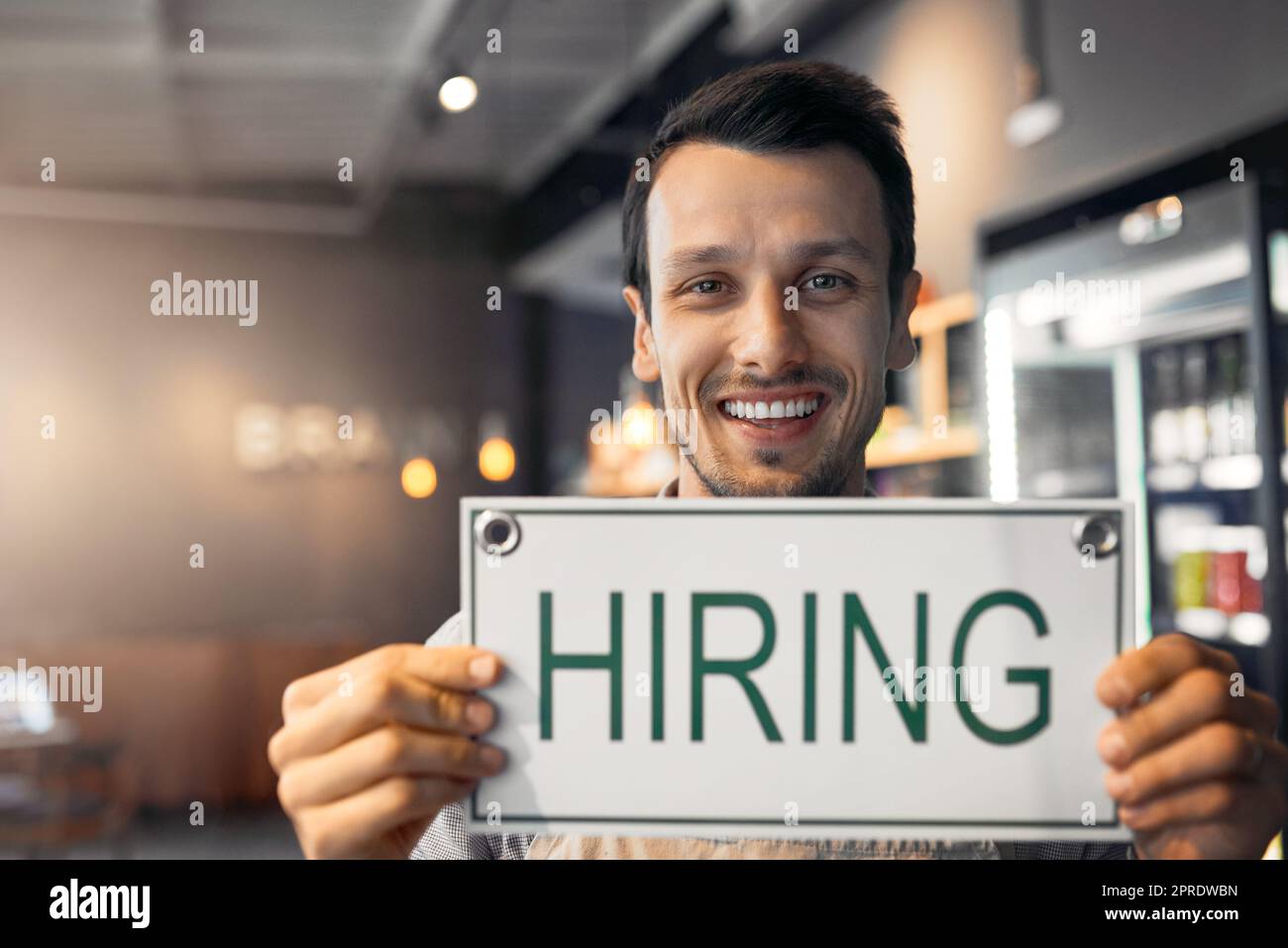Man standing holding sign hi-res stock photography and images - Alamy