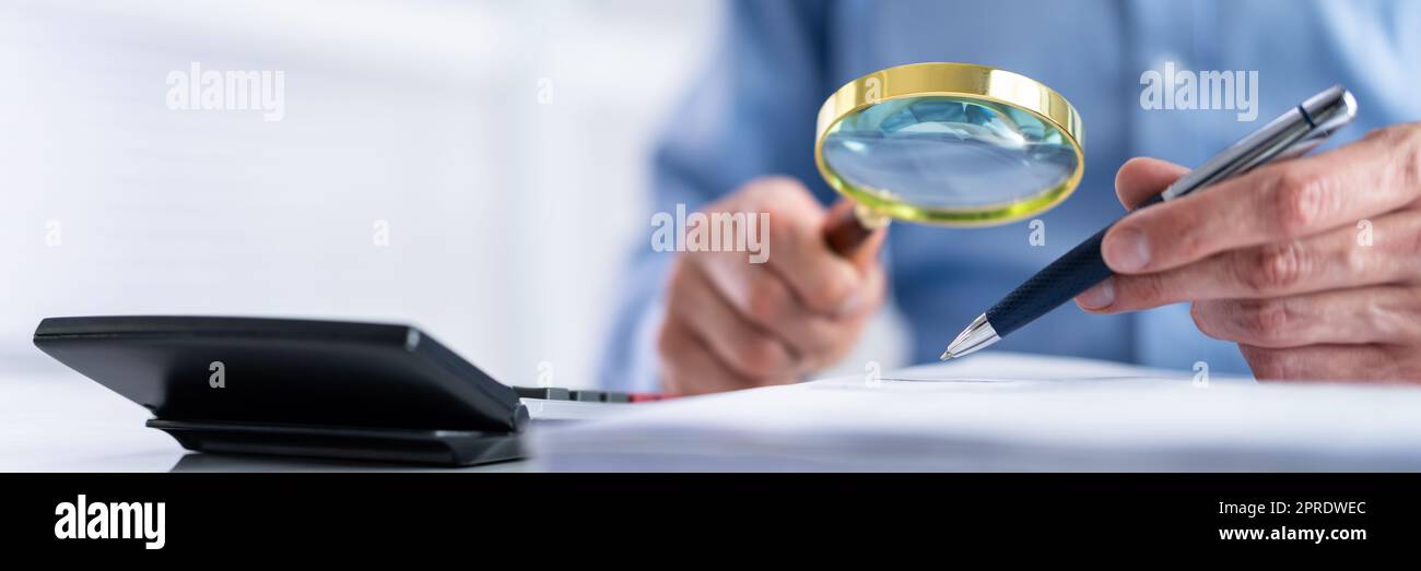 Business Fraud Investigation Using Magnifying Glass Stock Photo - Alamy