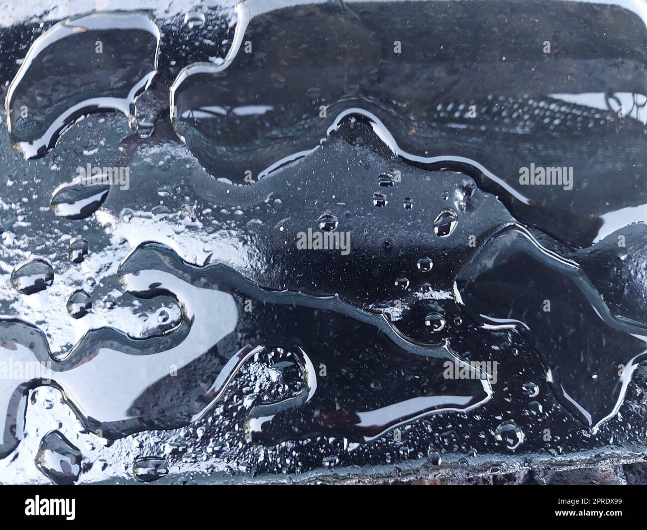 Spraying liquid bituminous mastic on the concrete foundation for the ...