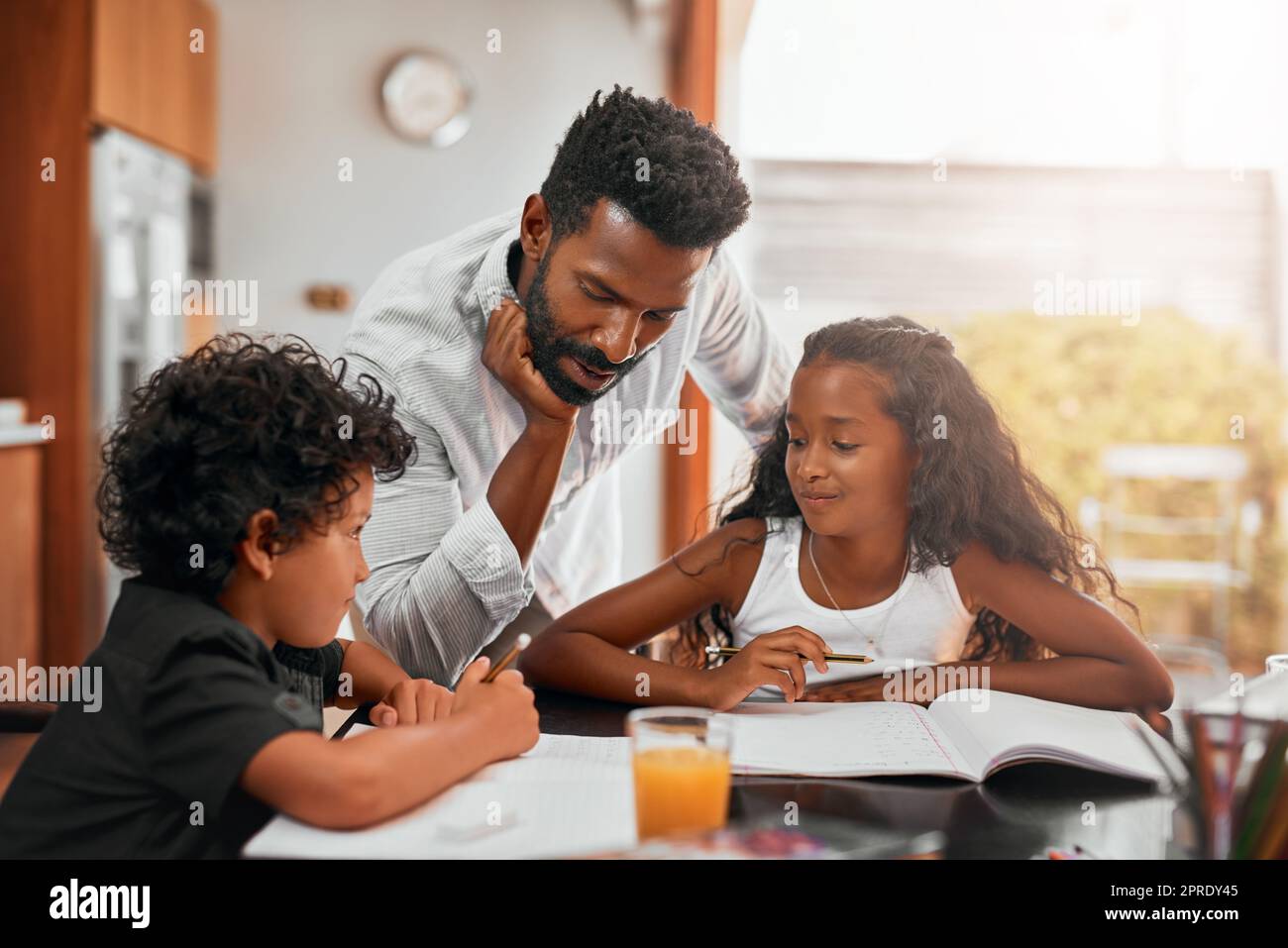 Girl helping boy homework hi-res stock photography and images - Alamy