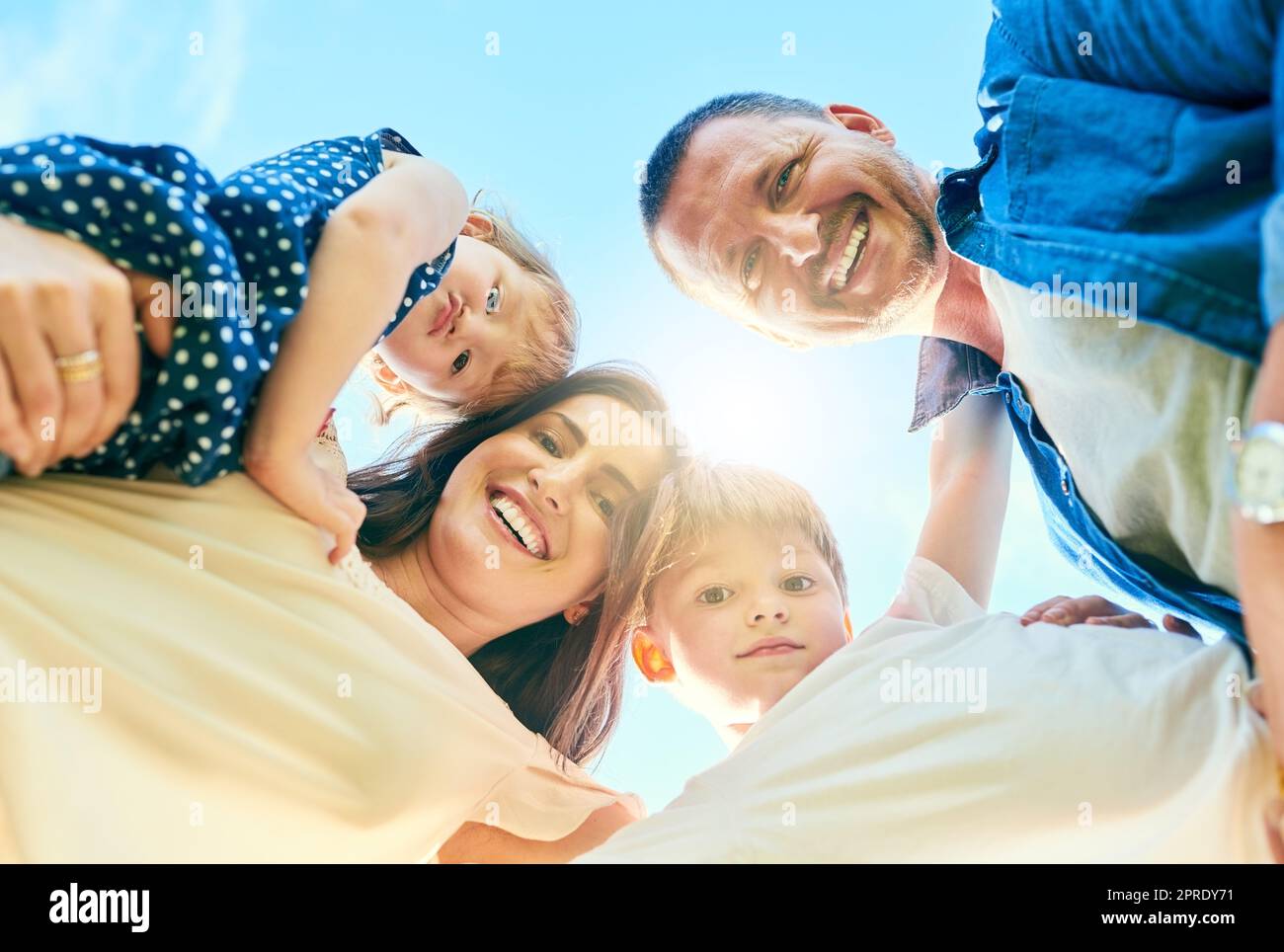 Out for some fresh air with the family. Low angle shot of a happy ...