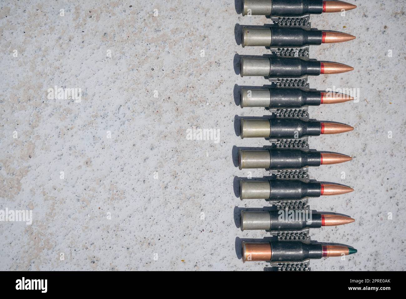 Machine gun belt loaded with cartridges Stock Photo - Alamy