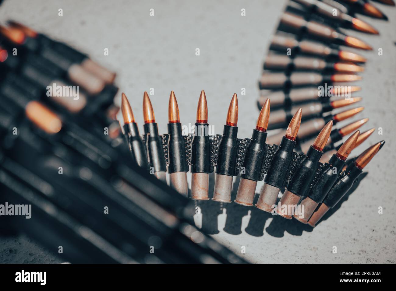 Machine gun belt loaded with cartridges Stock Photo - Alamy